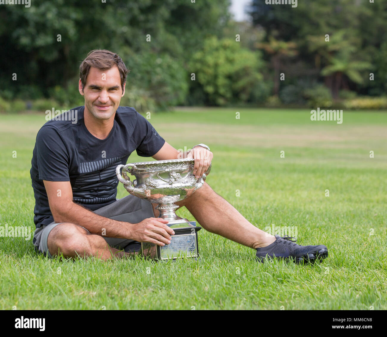 Swiss tennis player Roger Federer poses with the championship trophy of ...