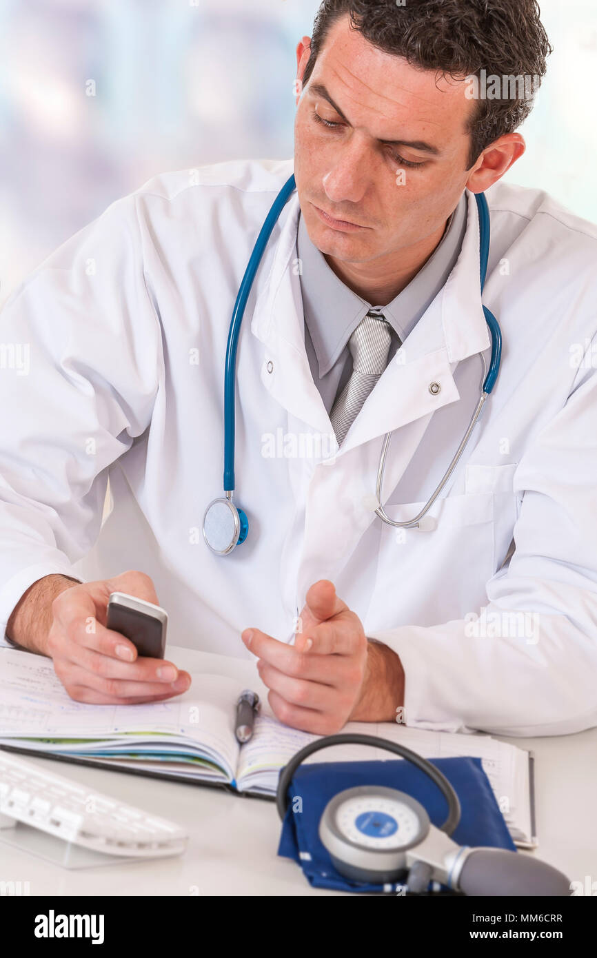 DOCTOR WITH PHONE Stock Photo - Alamy