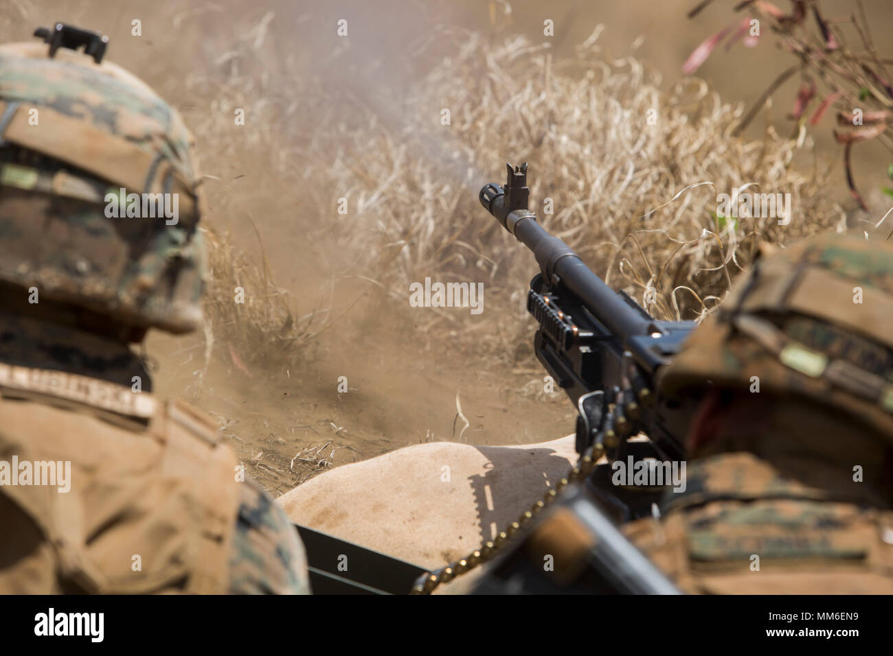 A machine gunner with Echo Company, 2nd Battalion, 3rd Marine Regiment ...