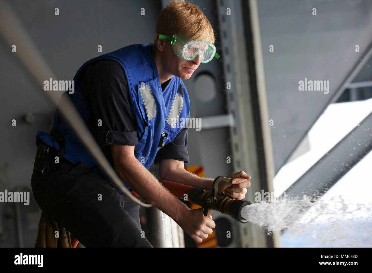 Charged fire hose hi-res stock photography and images - Alamy