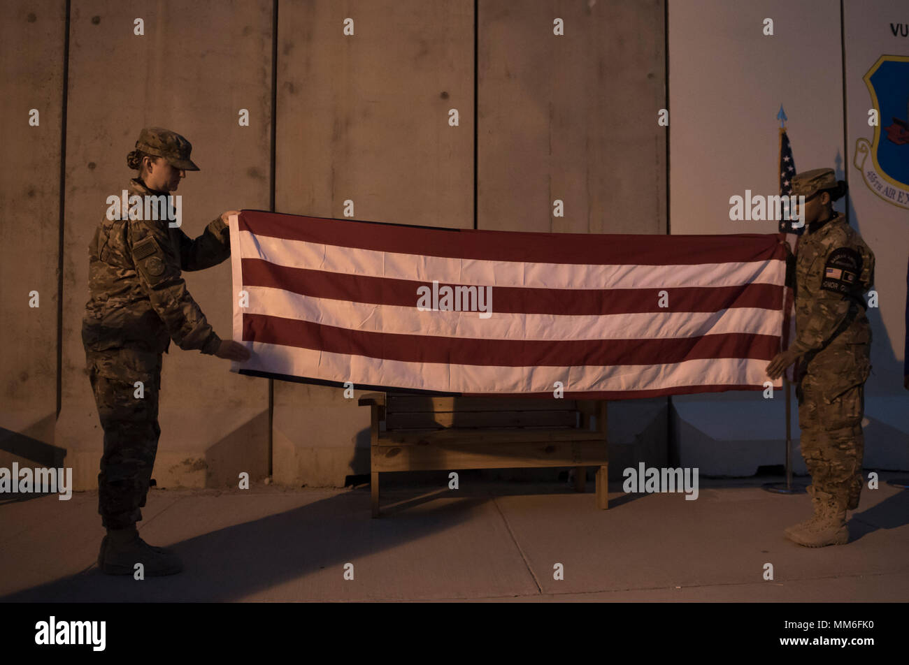 Bagram Honor Guard members fold the American flag during a 9/11 ...