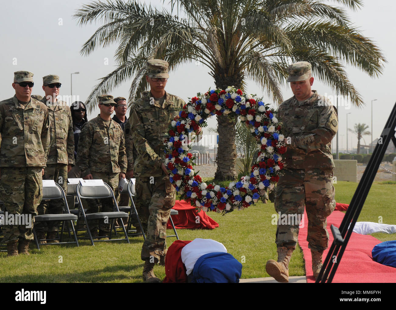 Col. Steven Berger (right), Area Support Group-Kuwait commander, and ...