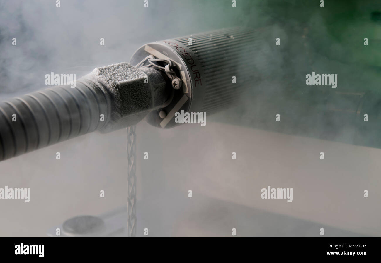 Ice forms around the hose of an oxygen generator and liquefier as it ...
