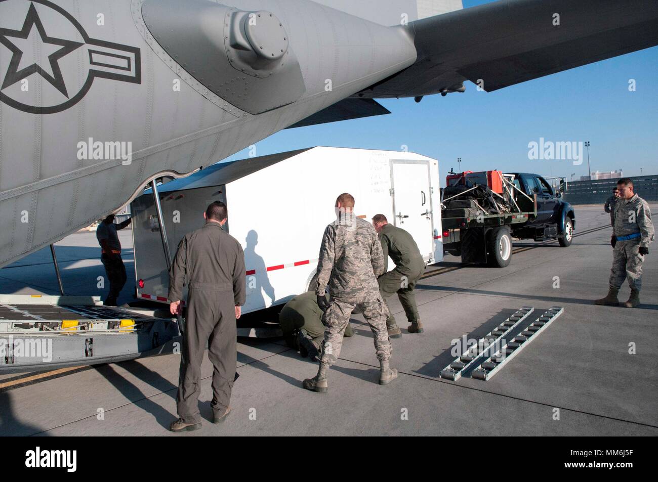 Airmen of the 152nd Airlift Wing, Nevada Air National Guard, load the ...