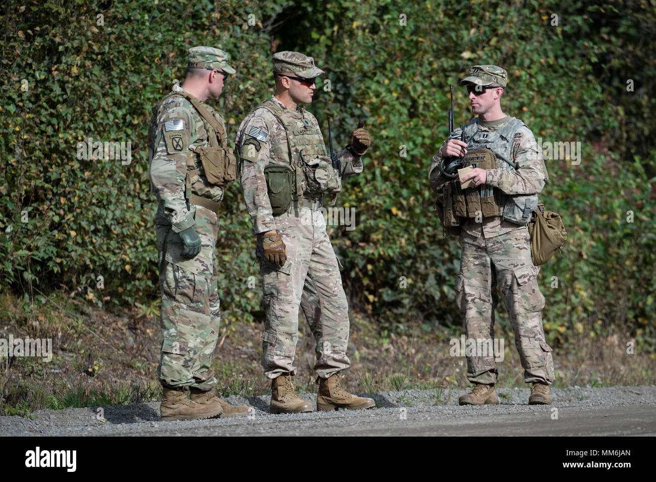 Army Lt. Col. R. Blake Lackey, center, the commanding officer of 1st ...