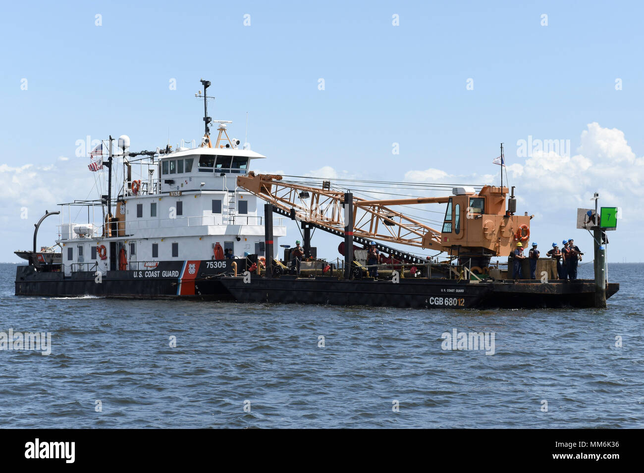 Crewmembers from Coast Guard Cutter Vise, a construction tender based ...