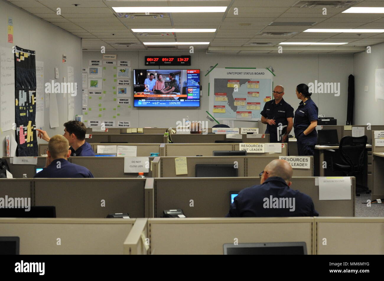Coast Guard members man computers and phones to keep communications ...