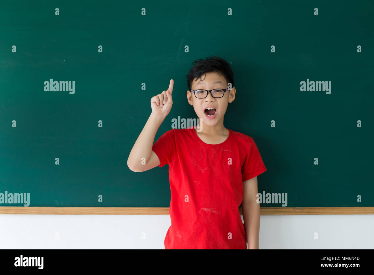 Asian student boy thinking answer for question in class room at school ...