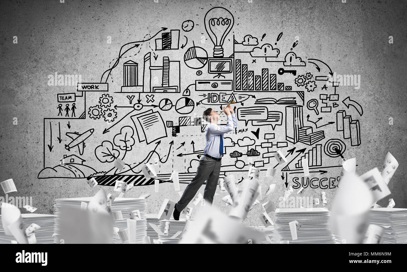 Happy businessman playing fife Stock Photo - Alamy
