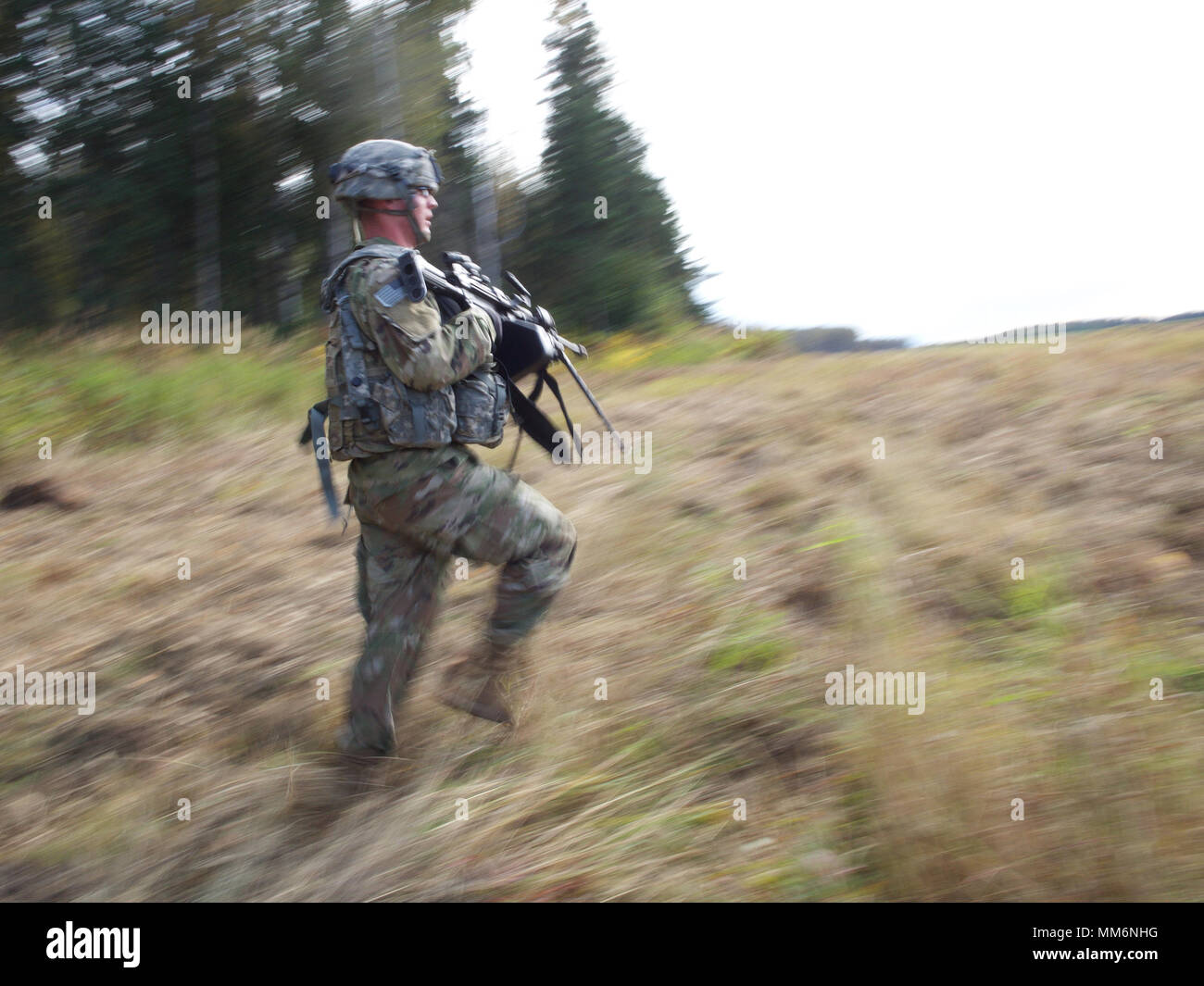 U.S. Army Pfc. Alex Burkholder, an M249 Squad Automatic Weapon gunner ...