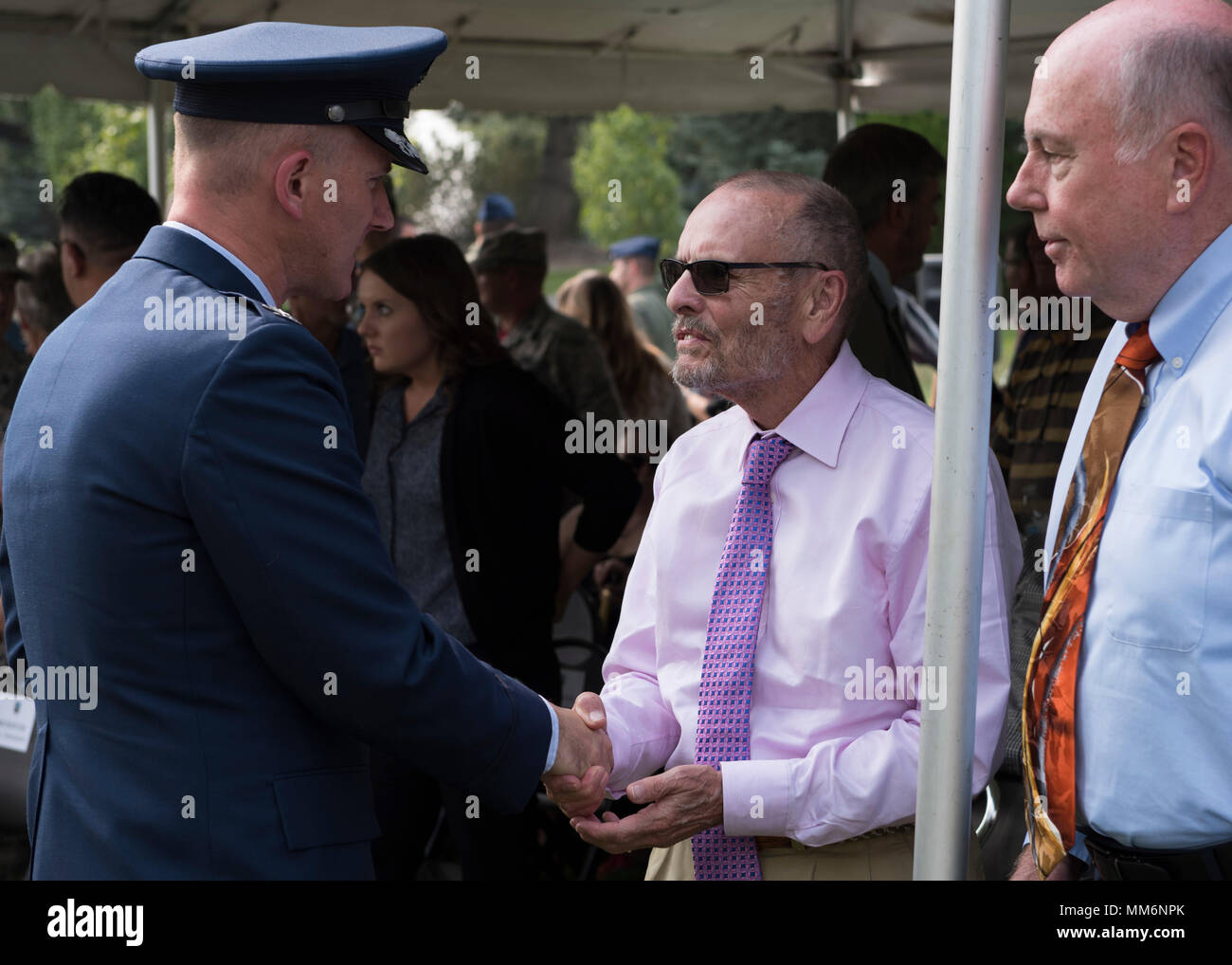 Col. Ryan Samuelson (left), 92nd Air Refueling Wing commander, presents ...