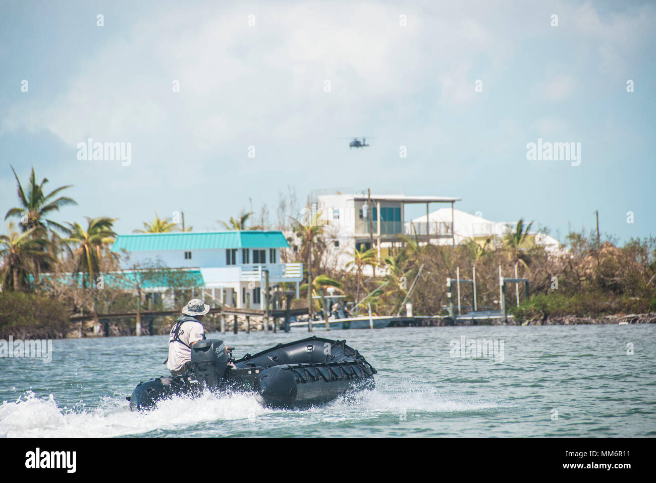 Specialist Steven Knipp spots a UH-60 Blackhawk team while crossing ...