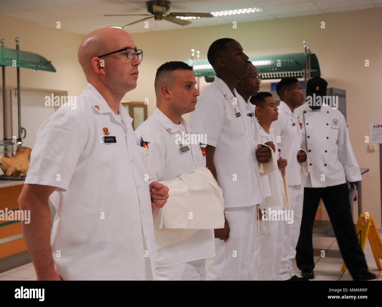 21st TSC culinary warrior participants line up to have their uniform ...