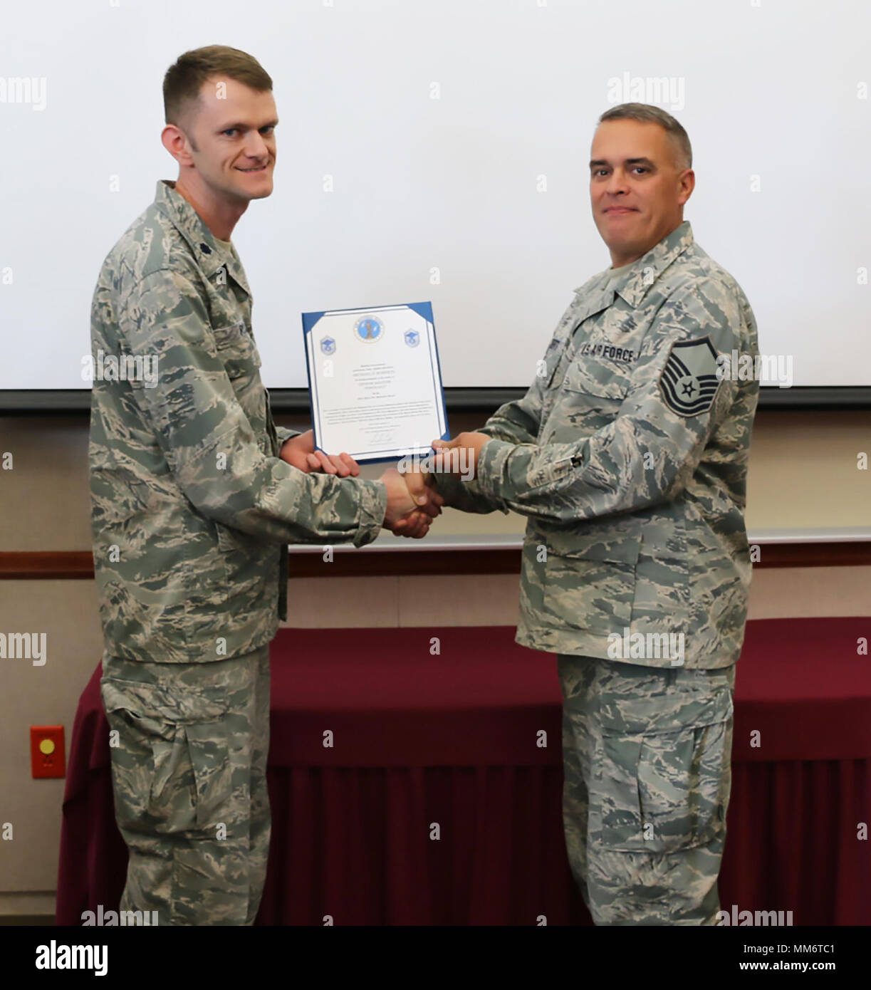 New York Air National Guard Senior Master Sgt. Michael Roberts, right ...