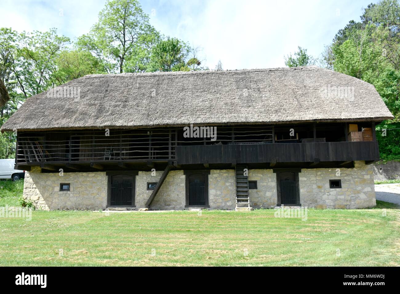 Wooden barn whit thatched roof Stock Photo - Alamy
