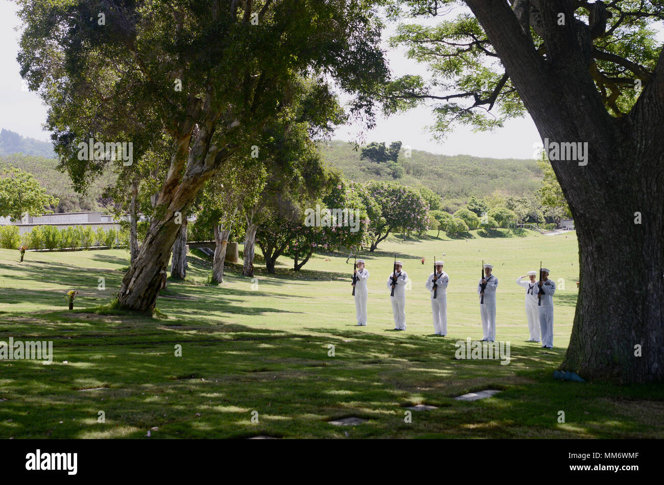 Members of the U.S. Navy Honor Guard stand ready to conduct a 21-gun ...