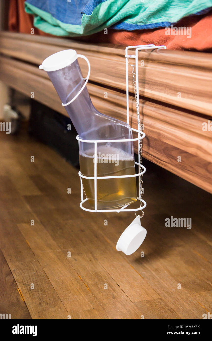 Urine bottle at nursing bed Stock Photo - Alamy