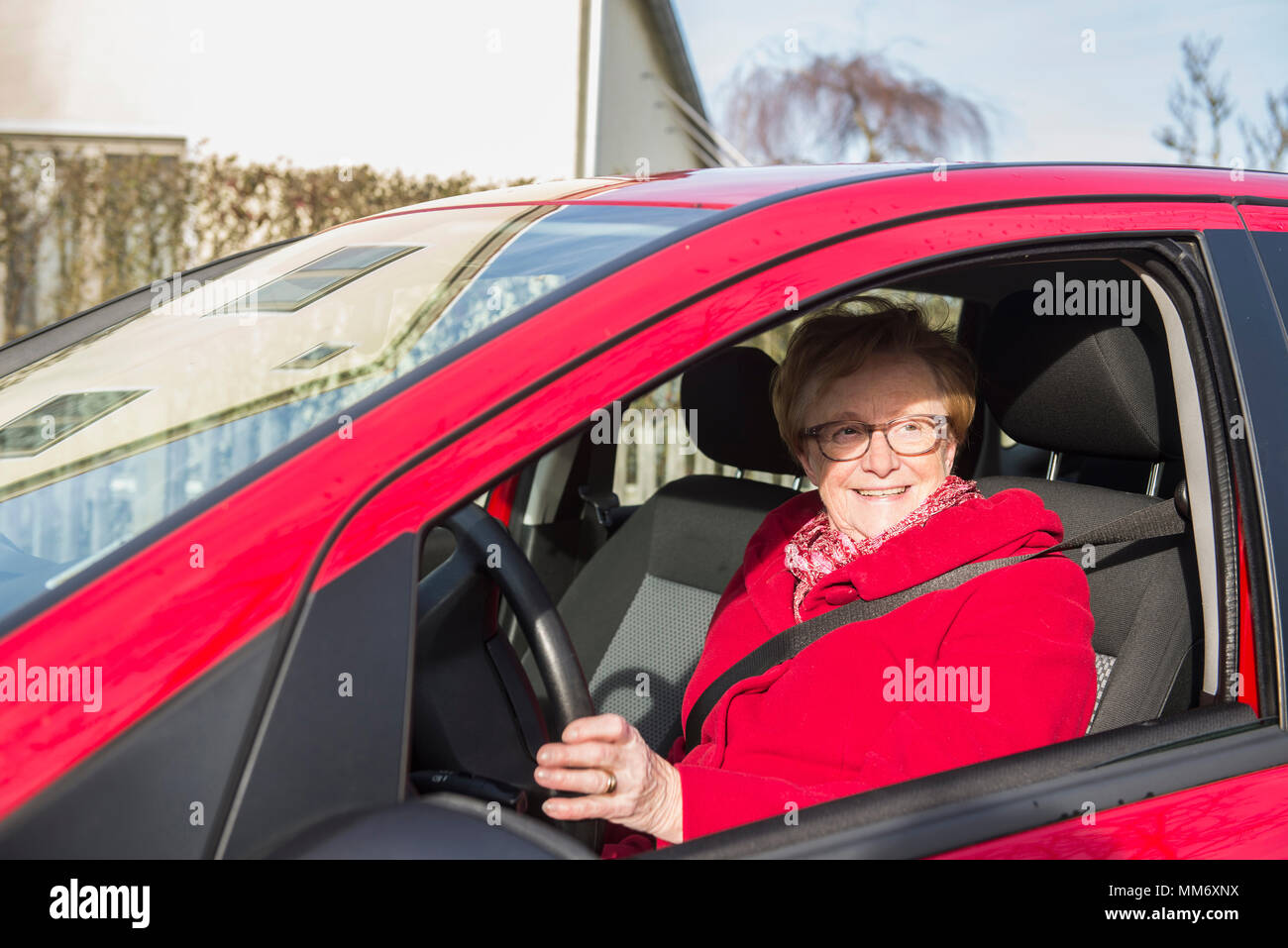 Happy old woman driving a car Stock Photo - Alamy