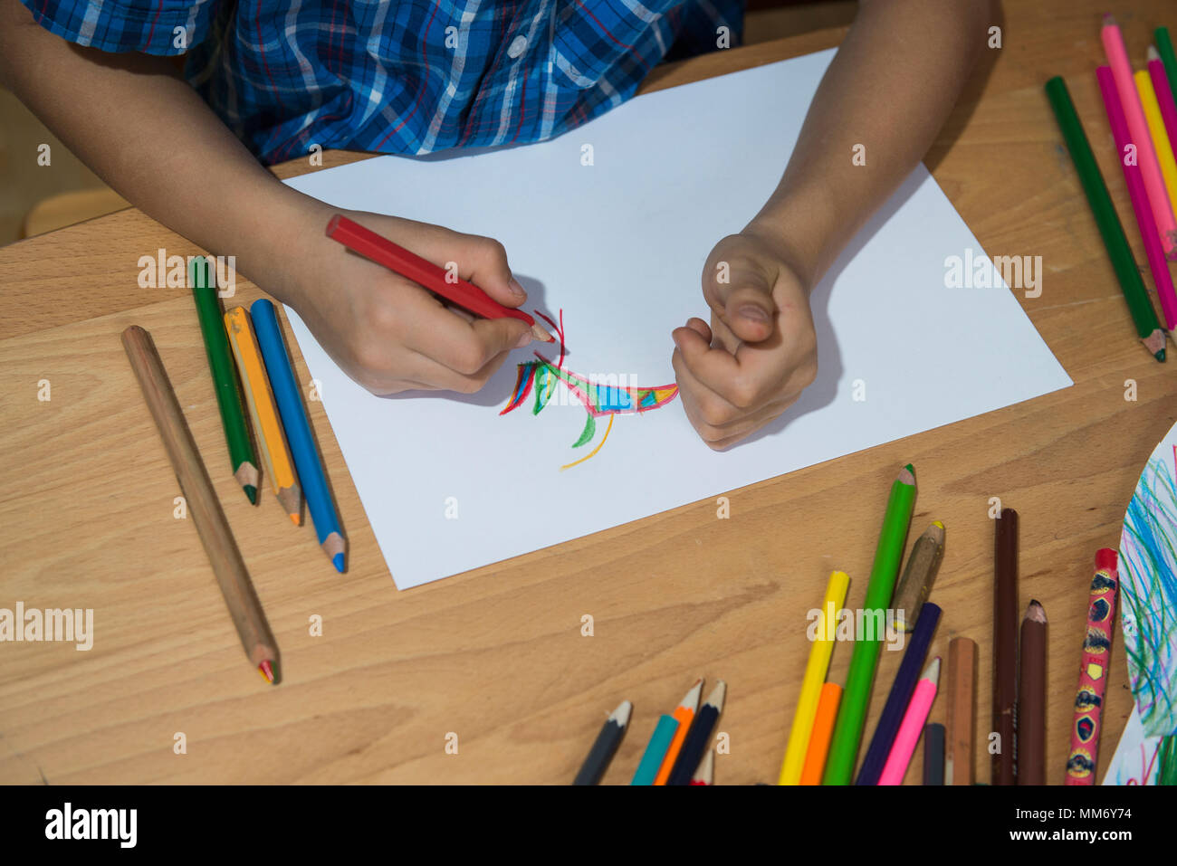 Close-up of a boy's hand coloring, Munich, Germany Stock Photo - Alamy