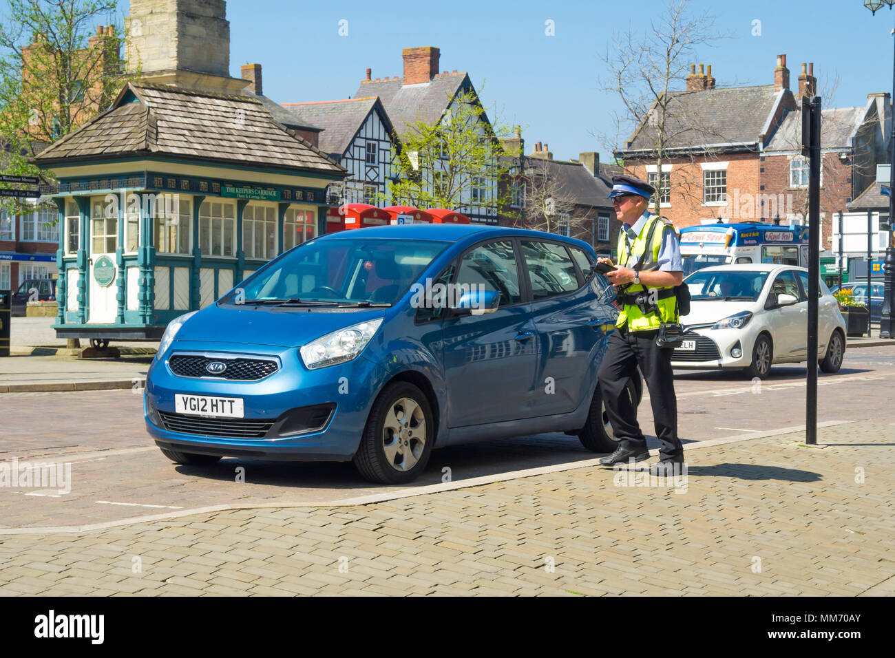 Traffic Warden taking details of a car improperly parked in Ripon ...