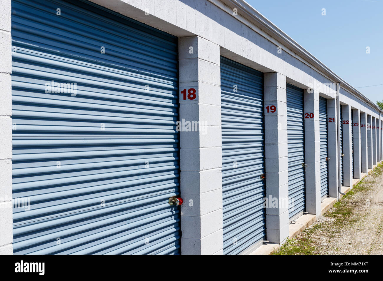 Numbered self storage and mini storage garage units Stock Photo - Alamy