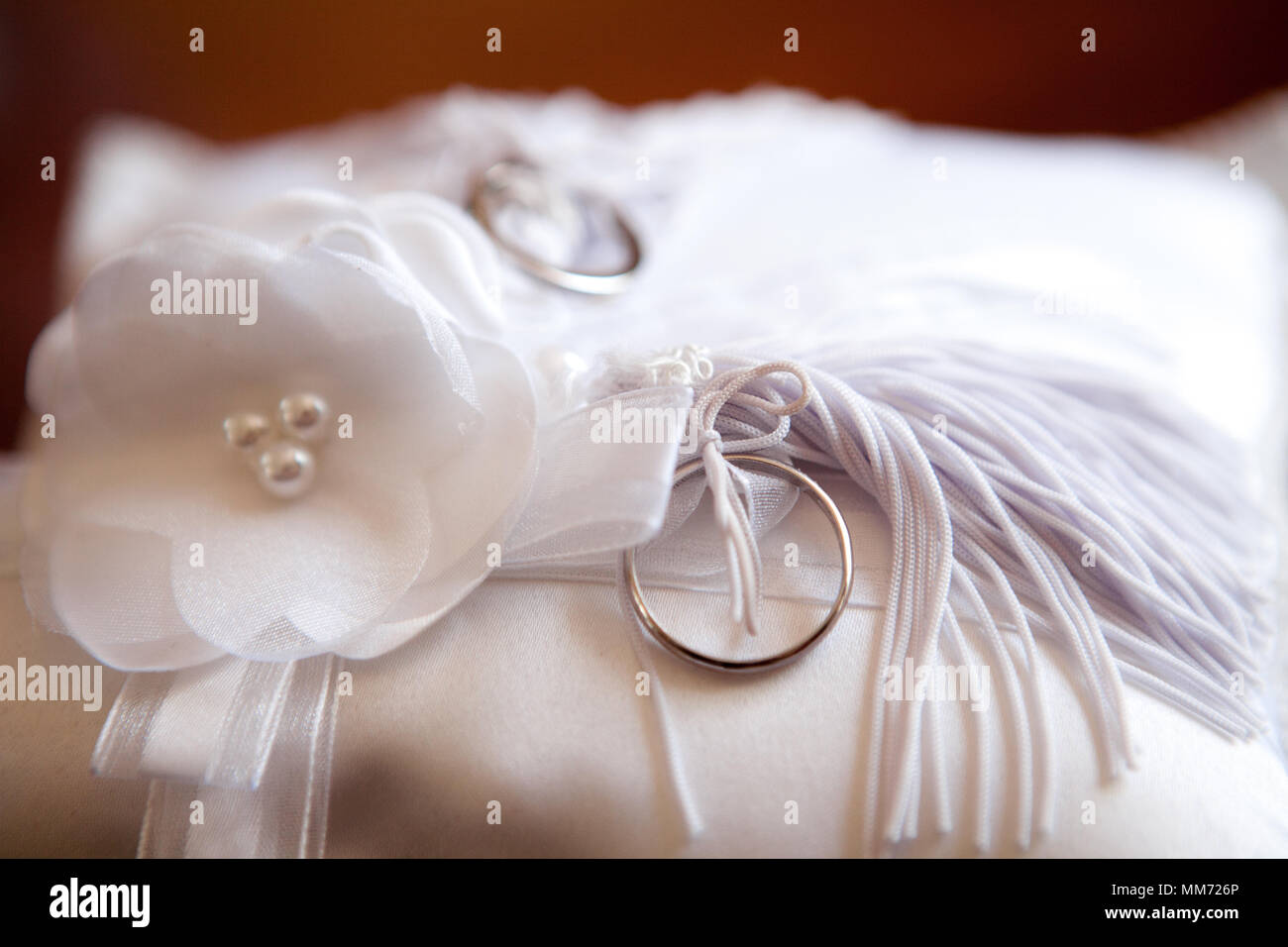 Wedding Rings on white cloth Stock Photo - Alamy