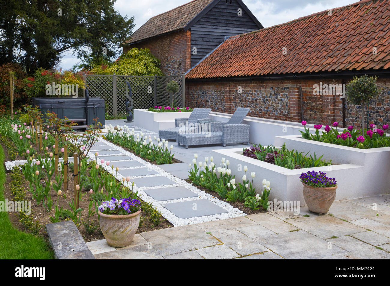 Symphony Vitrified Paving slabs form a path leading to a Hot Tub with ...
