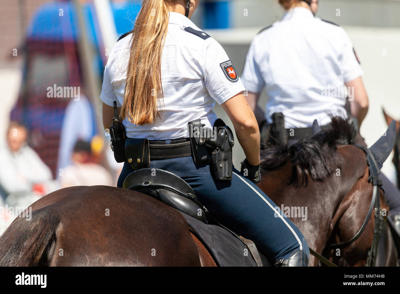 German police horsewoman rides on a police horse. The german word ...
