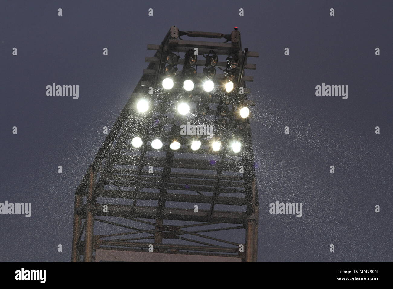 lights in stadium with rainfalling Stock Photo - Alamy