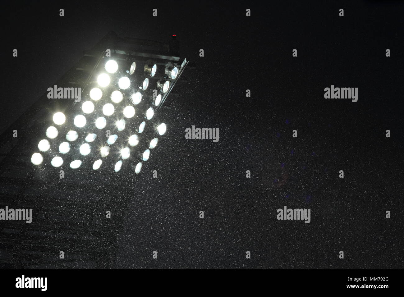 lights in stadium with rainfalling Stock Photo - Alamy