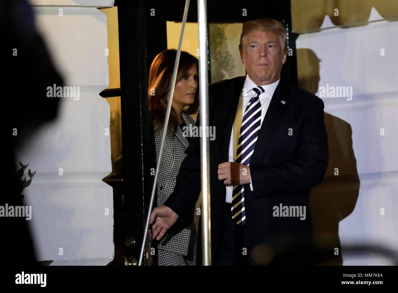 U.S. President Donald Trump and First Lady Melania Trump walk out from ...