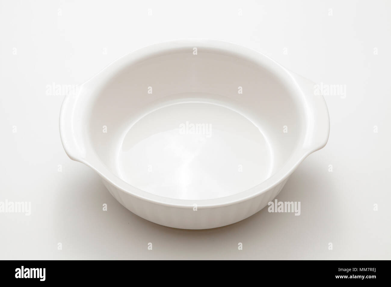 White circular gratin dish made of pottery Stock Photo - Alamy