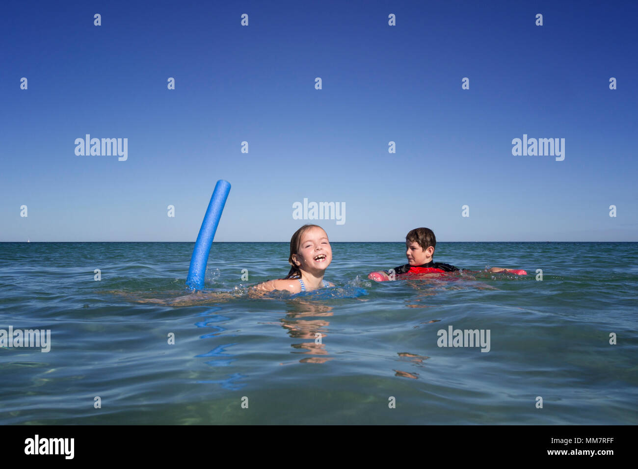 Two girls swimming hi-res stock photography and images - Alamy