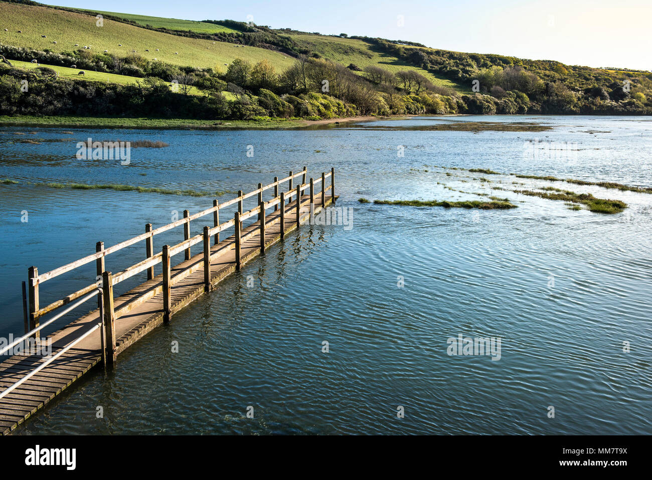 A wooden footbridge over the Gannel River in Newquay Cornwall Stock ...