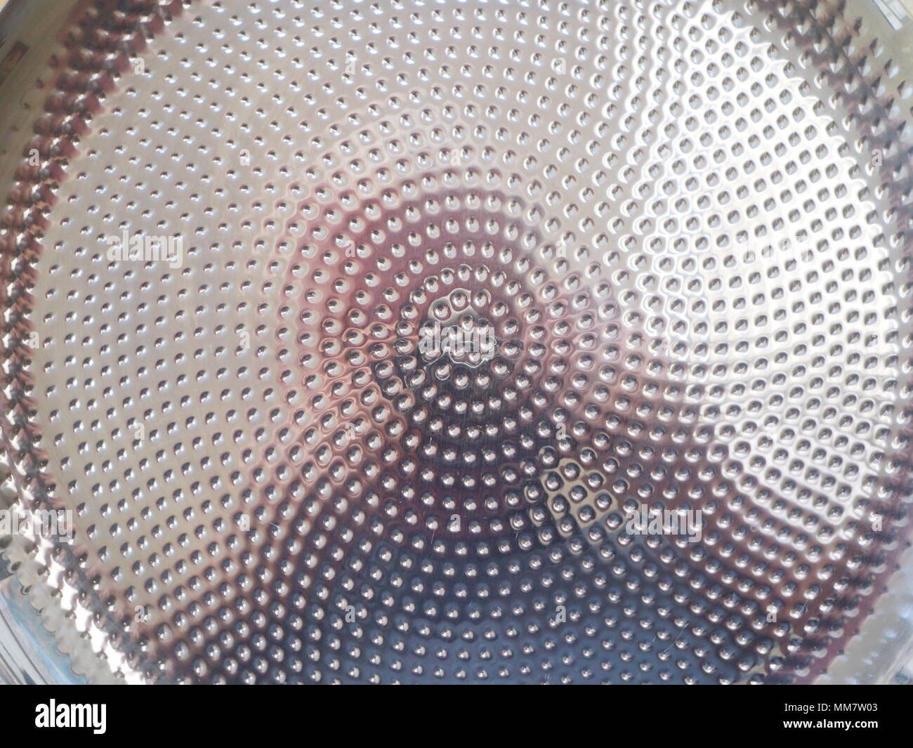 Dimpled silver tray, with photographer reflection Stock Photo - Alamy