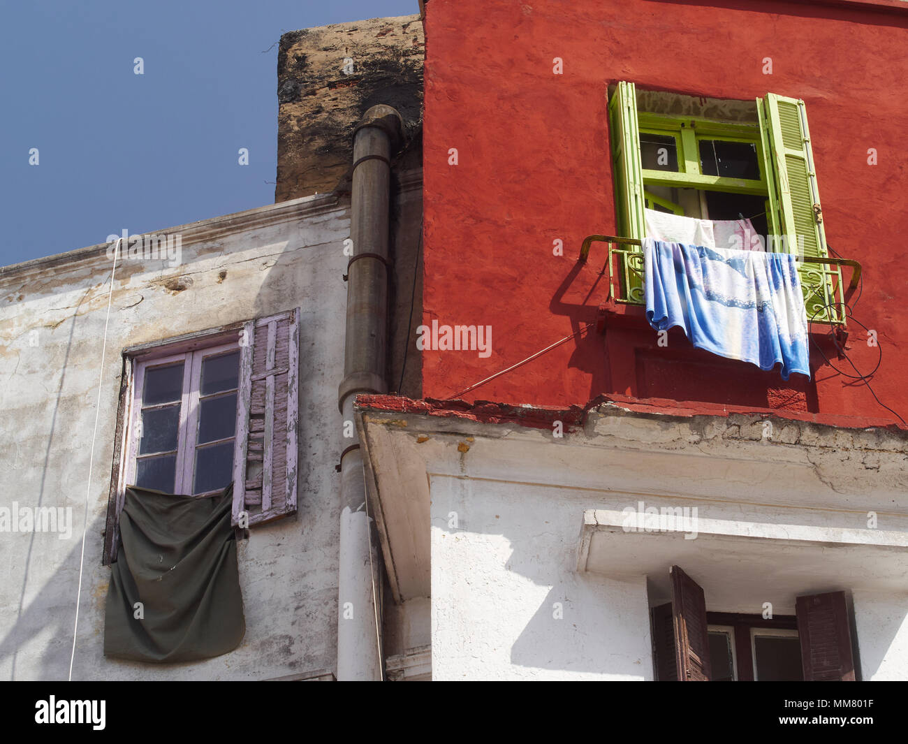 Wall of the house, decorated in squares of red and white, on the ...