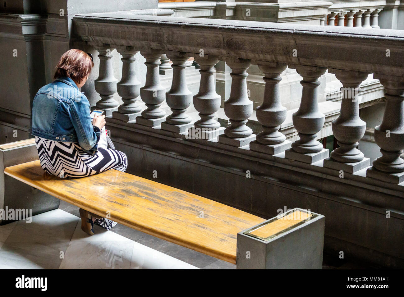 Mexican woman sitting on bench hi-res stock photography and images - Alamy