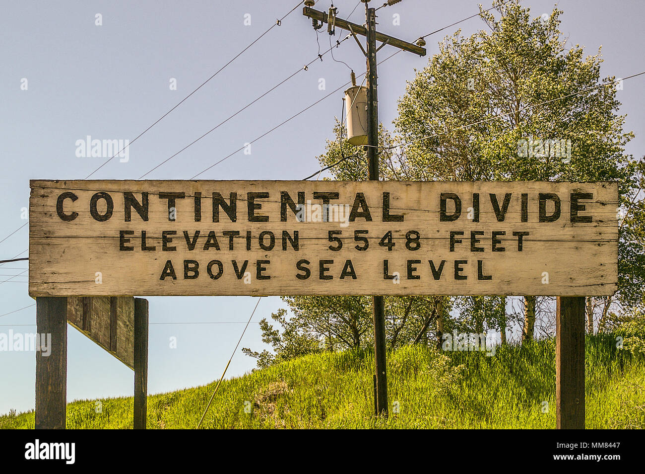 Large, wooden sign to mark the elevation of the Continental Divide near ...