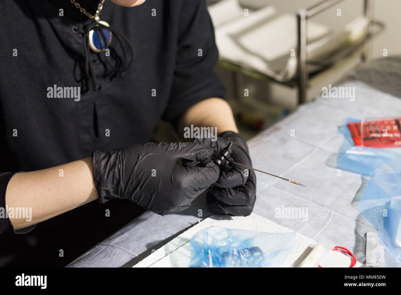 master tattoo artist prepares tools for tattooing Stock Photo - Alamy