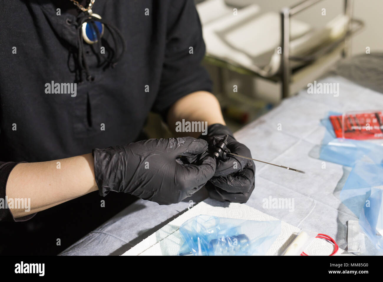 master tattoo artist prepares tools for tattooing Stock Photo - Alamy