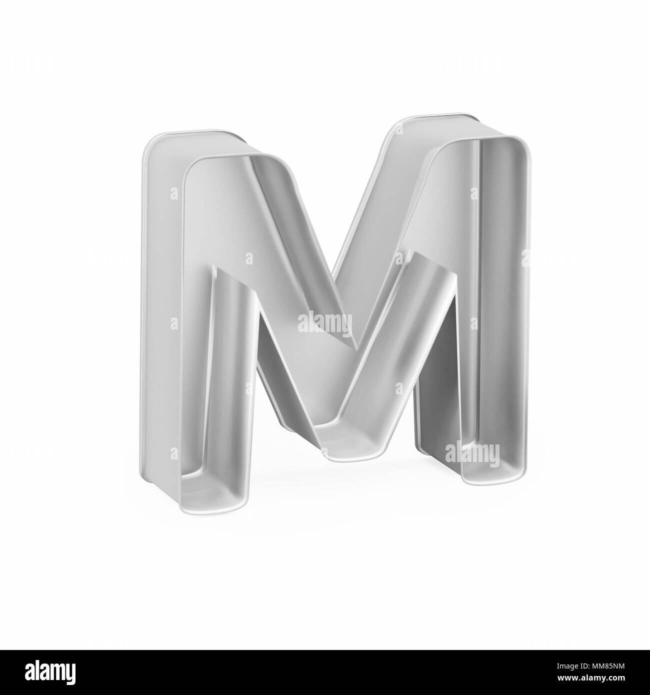 Metal baking cake pan or cookie cutter like capital letter M on white ...
