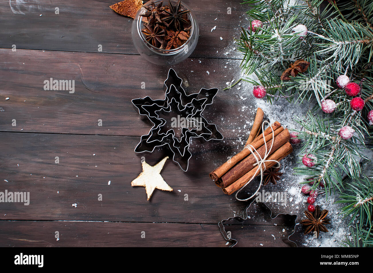 forms for biscuits, cinnamon sticks, anise and dried candied fruits on ...