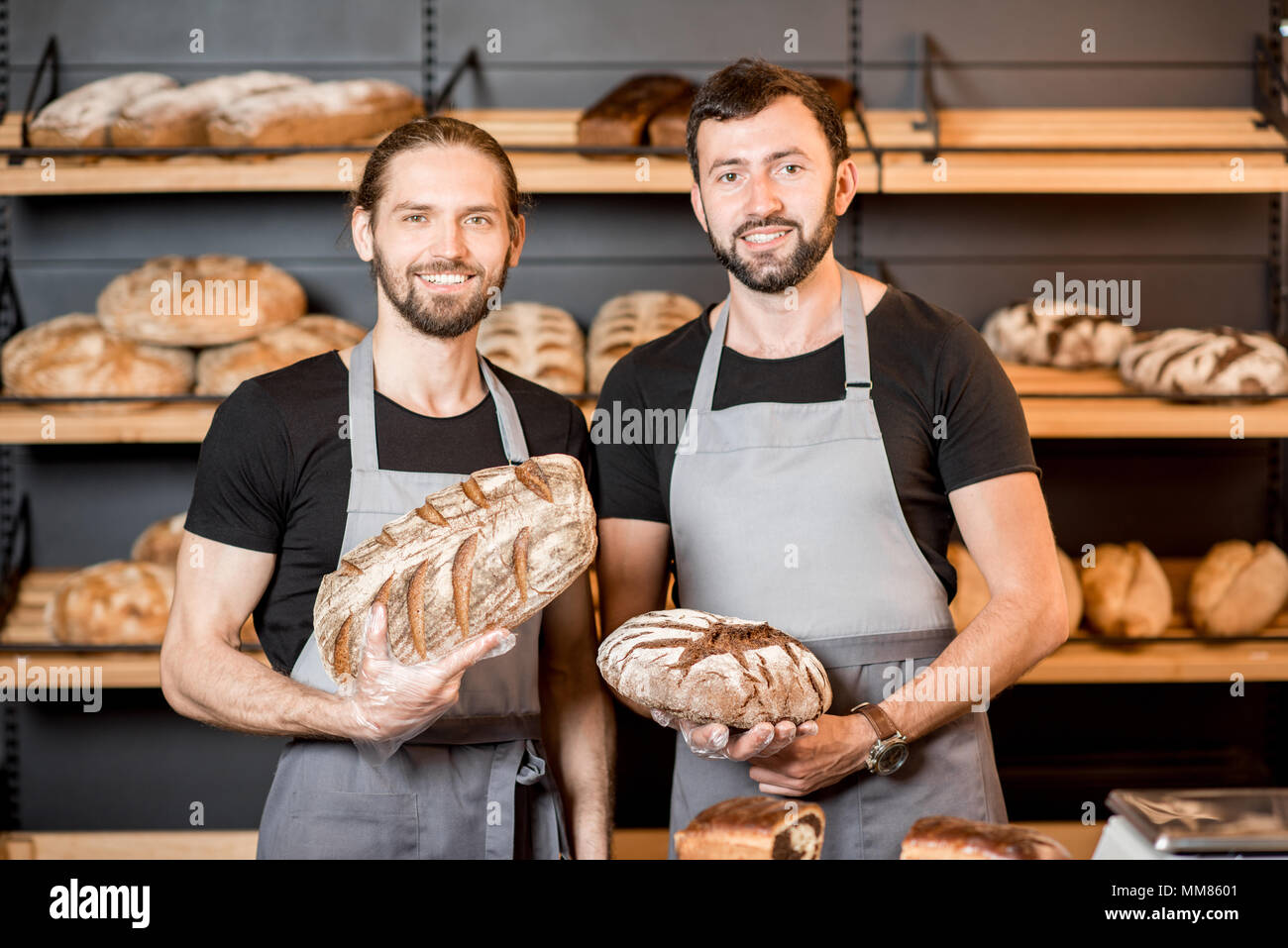 Bread sellers working at the bakery shop Stock Photo - Alamy