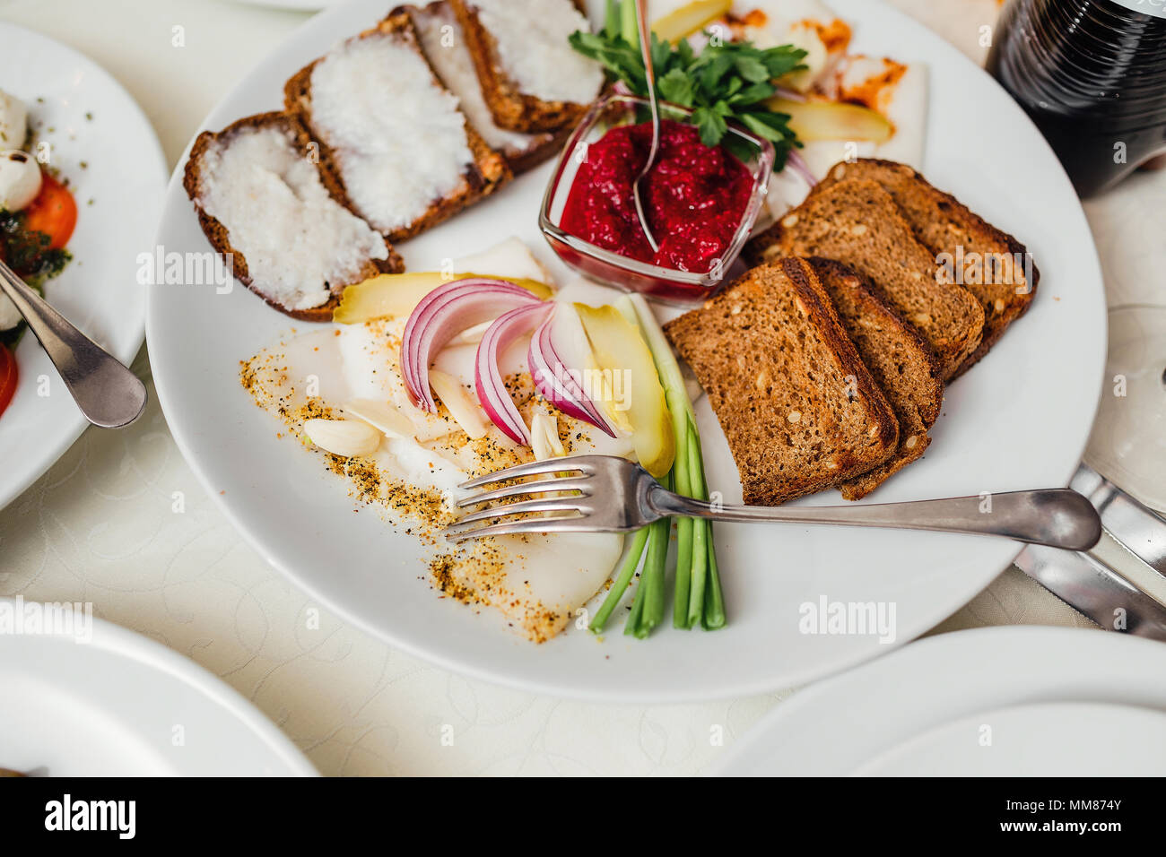 catering table set service with silverware and glass stemware at ...