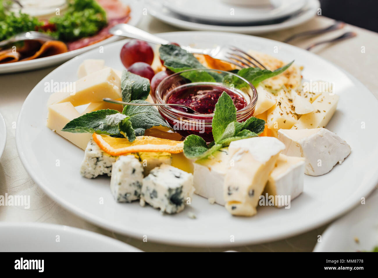 catering table set service with silverware and glass stemware at ...