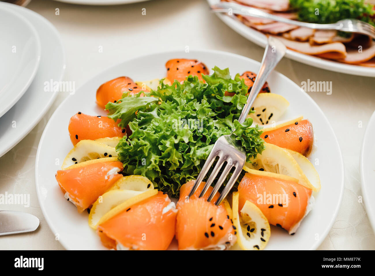 catering table set service with silverware and glass stemware at ...