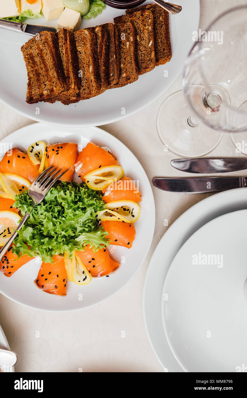 catering table set service with silverware and glass stemware at ...