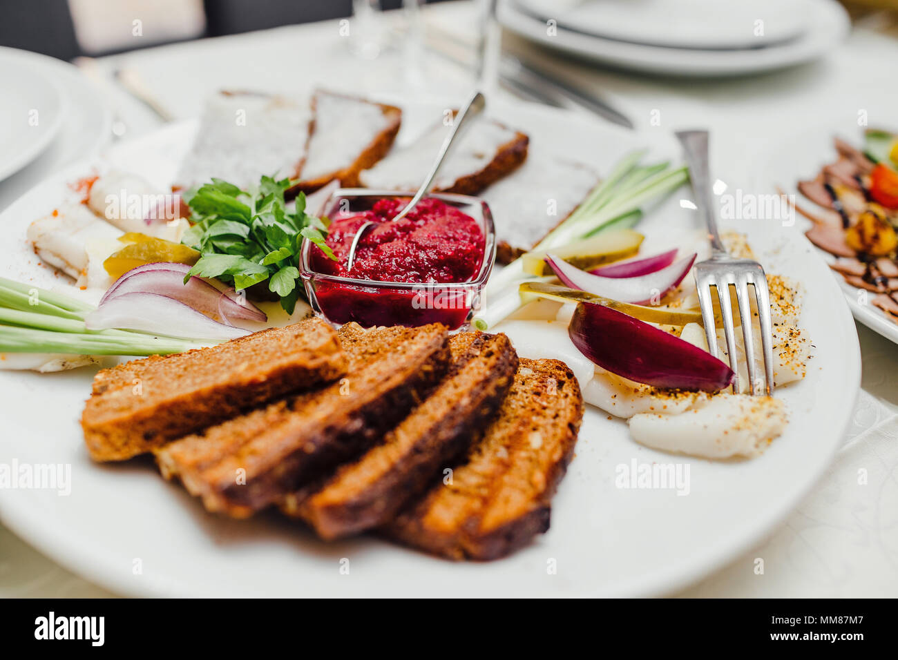 catering table set service with silverware and glass stemware at ...