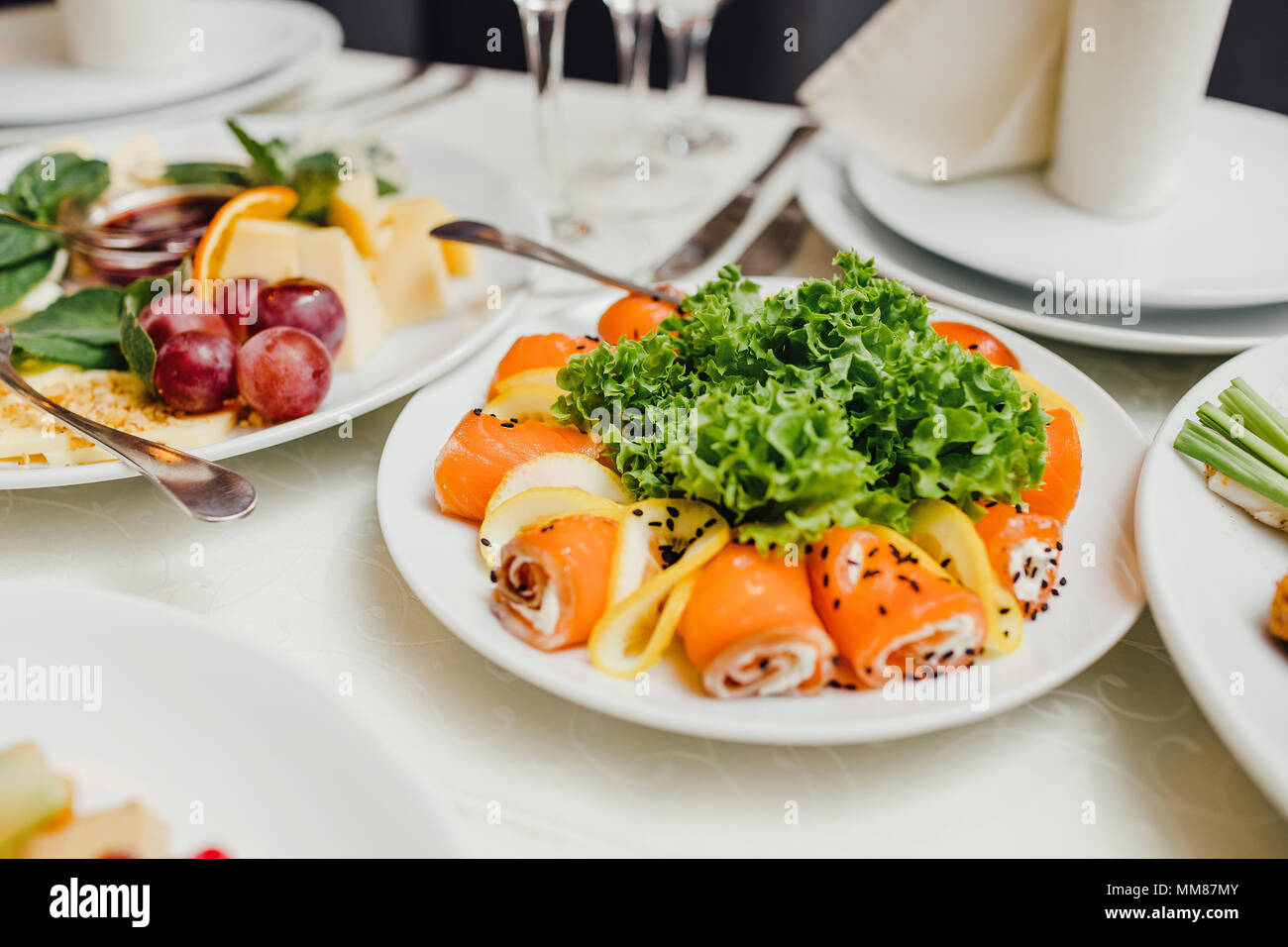 catering table set service with silverware and glass stemware at ...