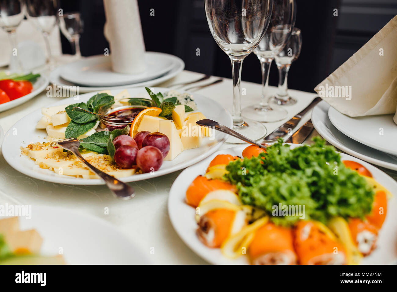 catering table set service with silverware and glass stemware at ...